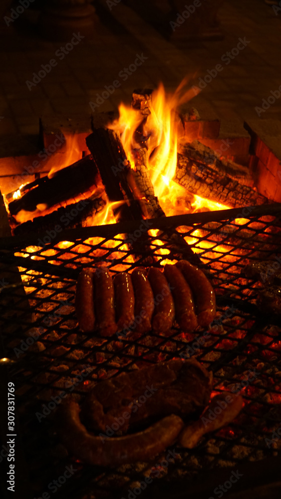 Cosy fire light up for a BBQ at a house in Stormsrivier, South Africa ...