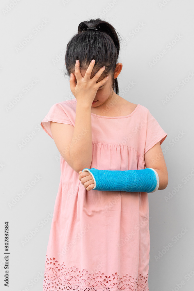 Asian Child with Broken Arm in Cast with Hurting and Sad Face ...