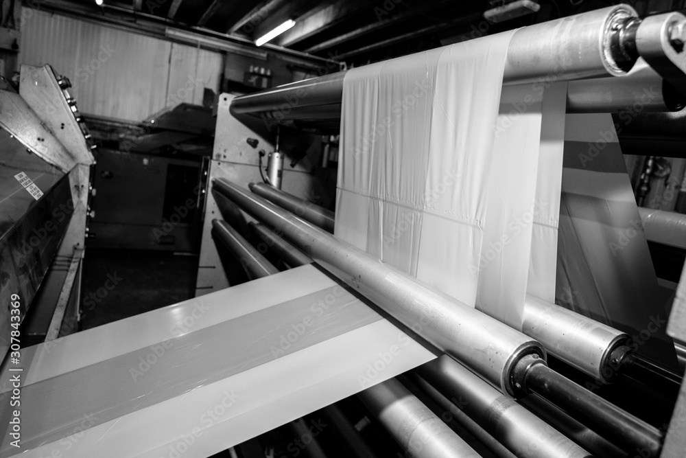 Black & White imagery of spool of plastic packaging sheet heavy duty ...