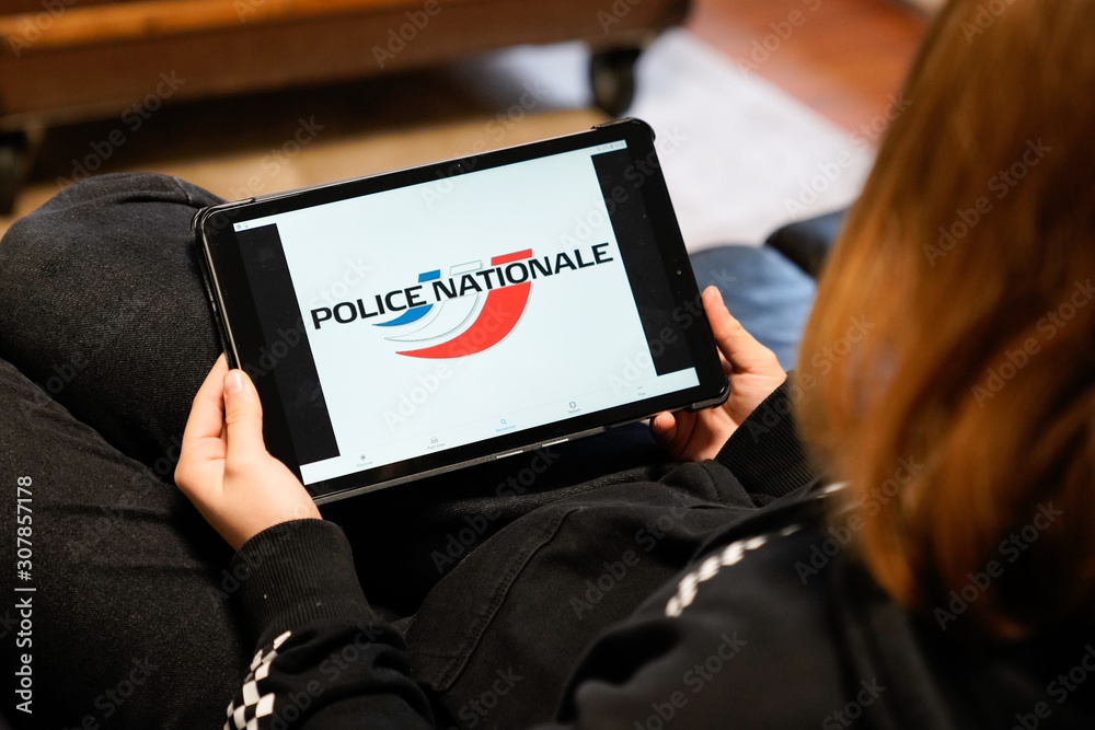 police nationale sign logo french in screen tablet hands young woman ...