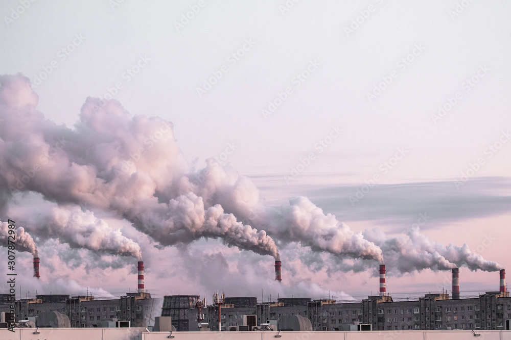 industrial chimneys with heavy smoke causing air pollution as ...