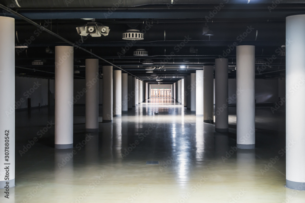 long corridor with round columns in the basement of the building Stock ...