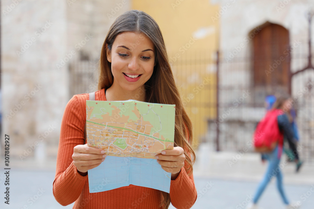 Travel girl visiting city searching direction on map. Happy cheerful ...