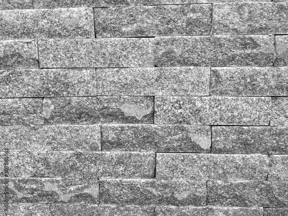 Modern rock stone wall background made of bricks on a wall of the ...