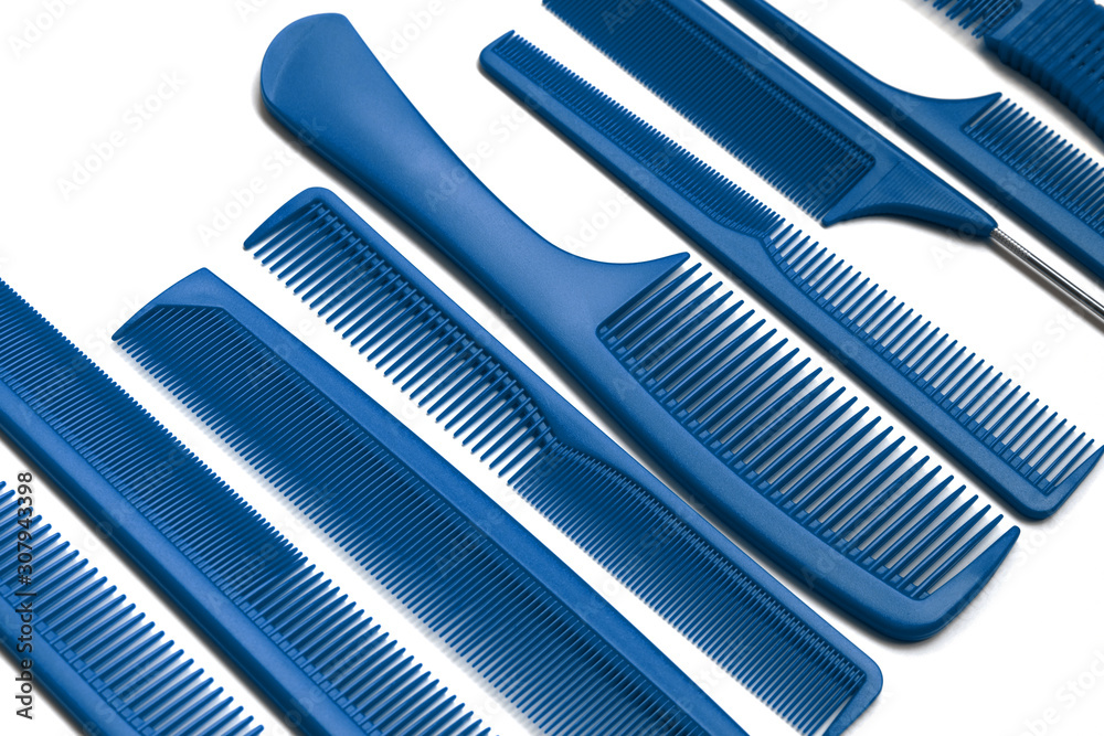 Set of different blue hair combs on a white background. Color of the ...