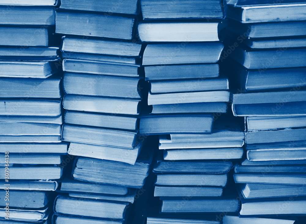 Classic blue colour chaotic stack of old books background. Background ...