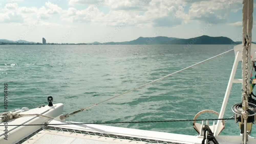 Front view of yacht boat ship sail through the ocean with day light and ...