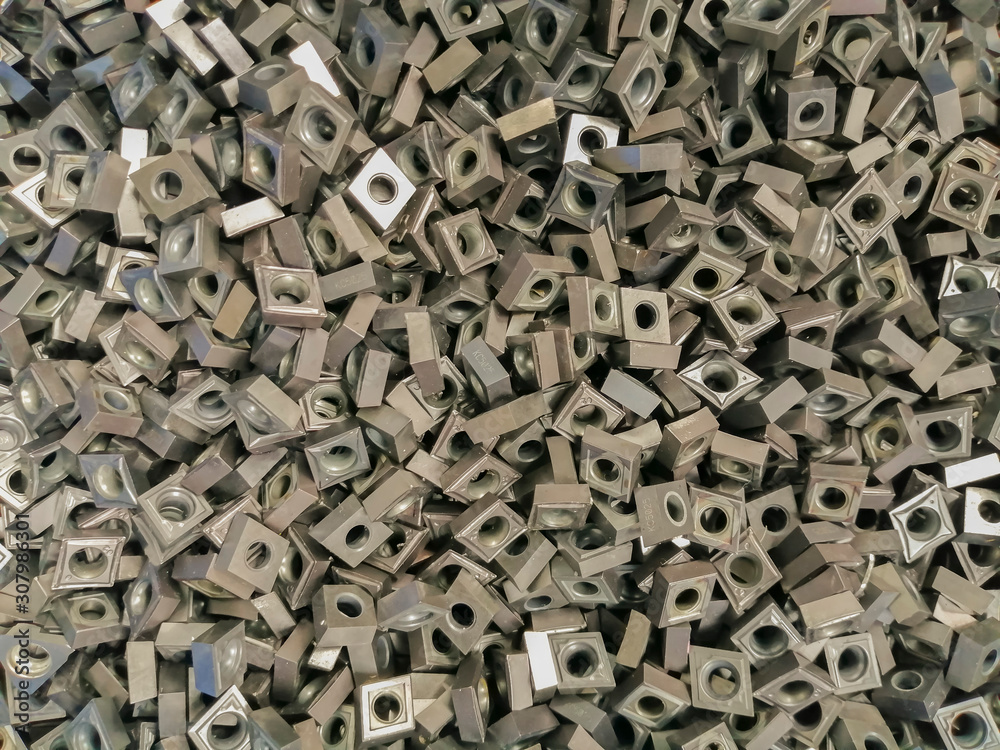 The close-up, metal blade for the milling machine is placed in the husk ...