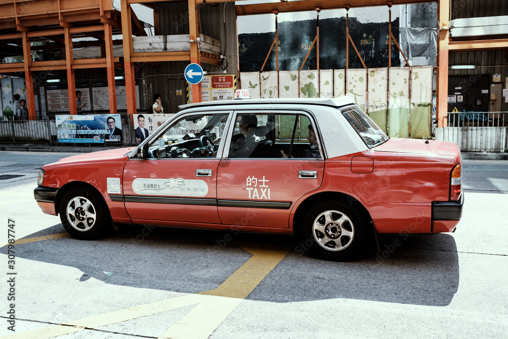 HONG KONG - OCTOBER 24, 2017_Urban red taxi with passengers, The Urban ...