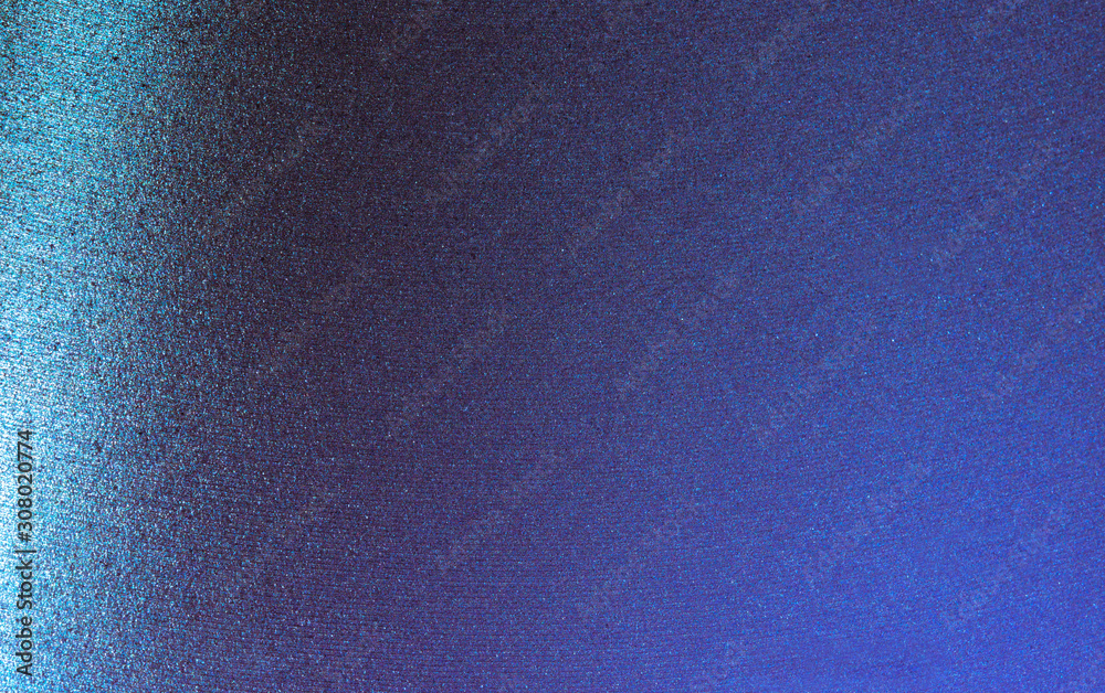 Abstract metal disk background texture shimmers in bright indigo blue ...
