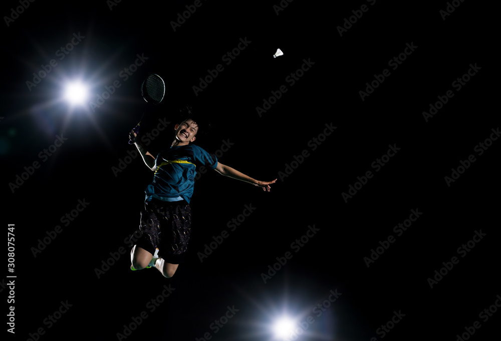 Asian badminton player is jump and hit the badminton ball Stock Photo ...