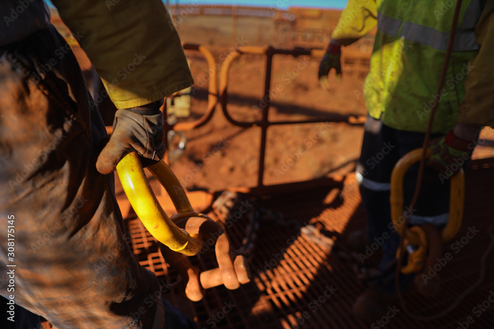 Defocused of construction male rigger hands wearing a heavy duty safety ...