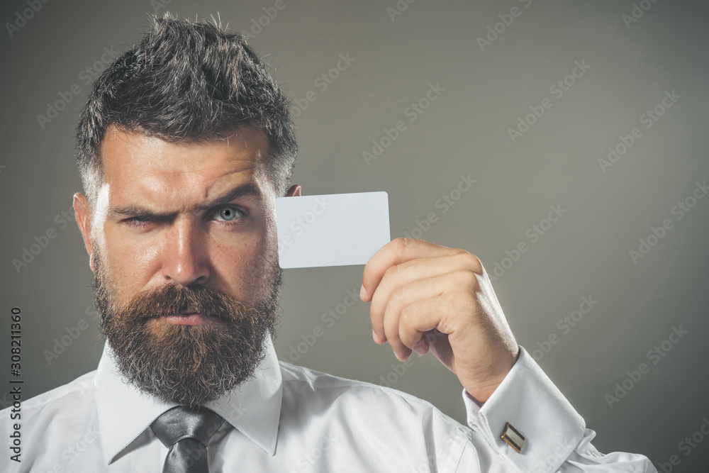 Business branding. Serious bearded man with blank business card in hand ...
