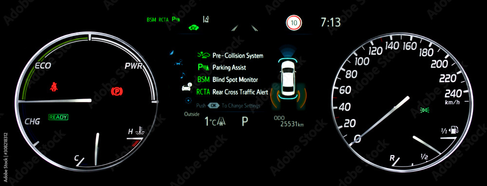 Illuminated car dashboard panel with speedometer, power meter, odometer ...