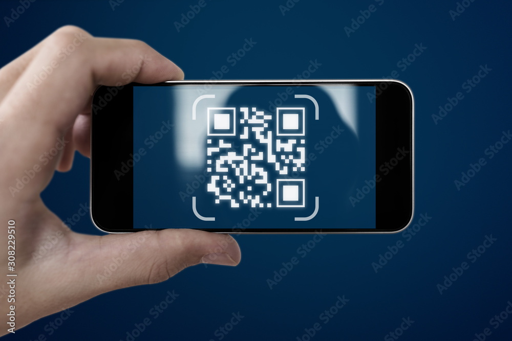 QR code scanning payment and verification. Hand using mobile smart ...