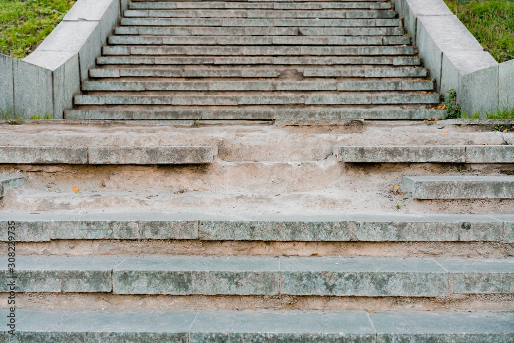 Big broken stairs in the the park made from concrete. Dangerous. Unsafe ...