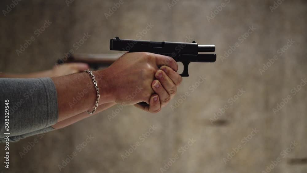 Gun Firing Last Round of Pistol at a Firing Range With Another Shooter ...