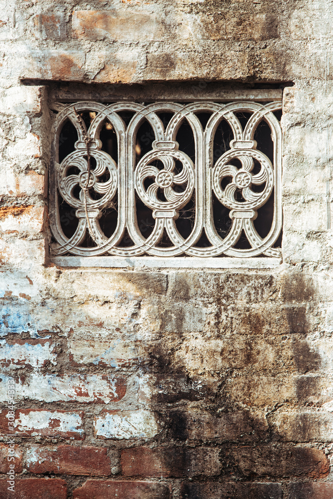 Beautiful vintage ancient old carved window with glass with a forged ...