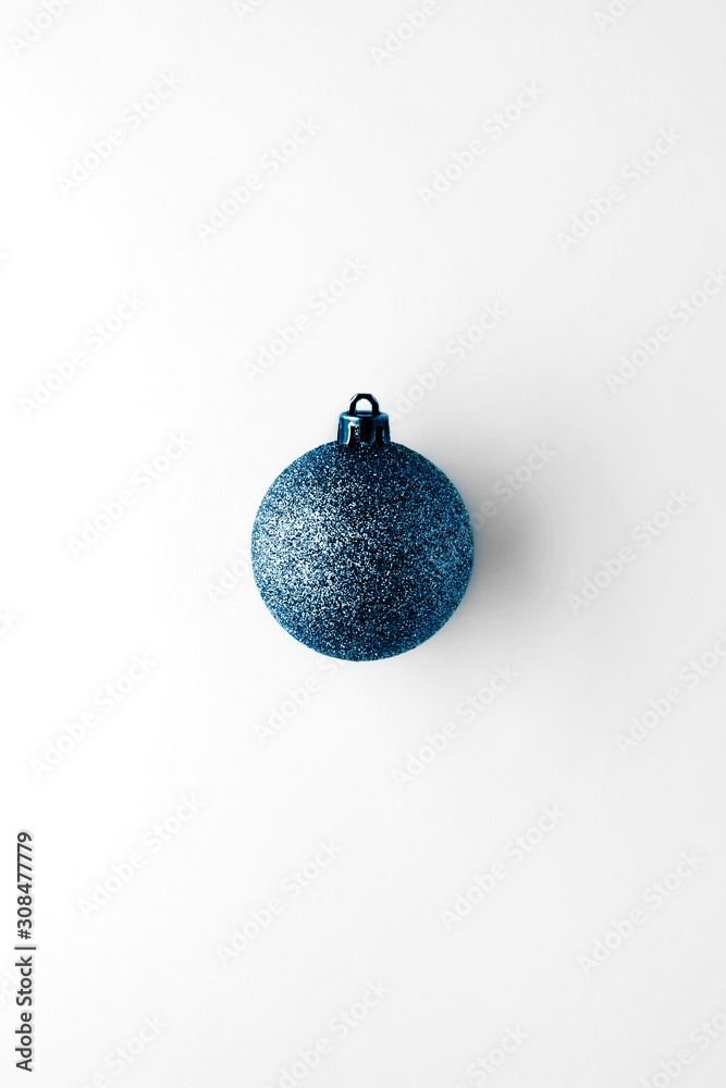 Trendy shiny metallic classic blue color Christmas ball on white ...