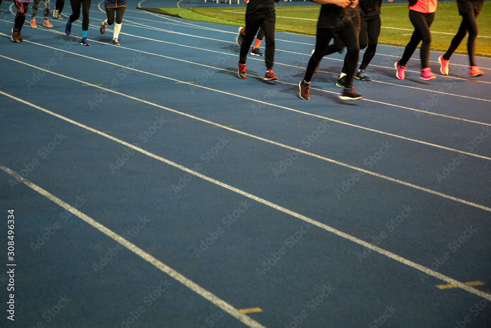 Runners at the stadium. Athletes are involved in athletics. Treadmills ...
