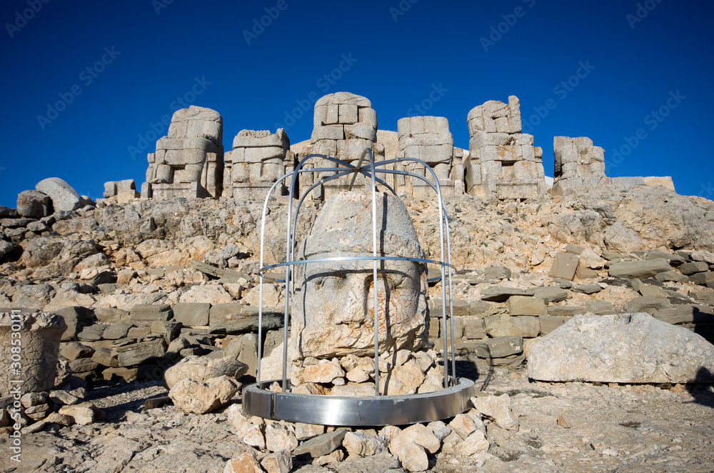 fallen head statue of Zeus in front of ancient god body statues at ...