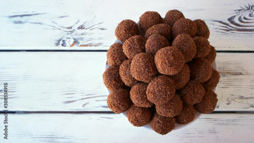 Pile of dark ball shaped sweets. Ball shaped creamy candies, top view ...