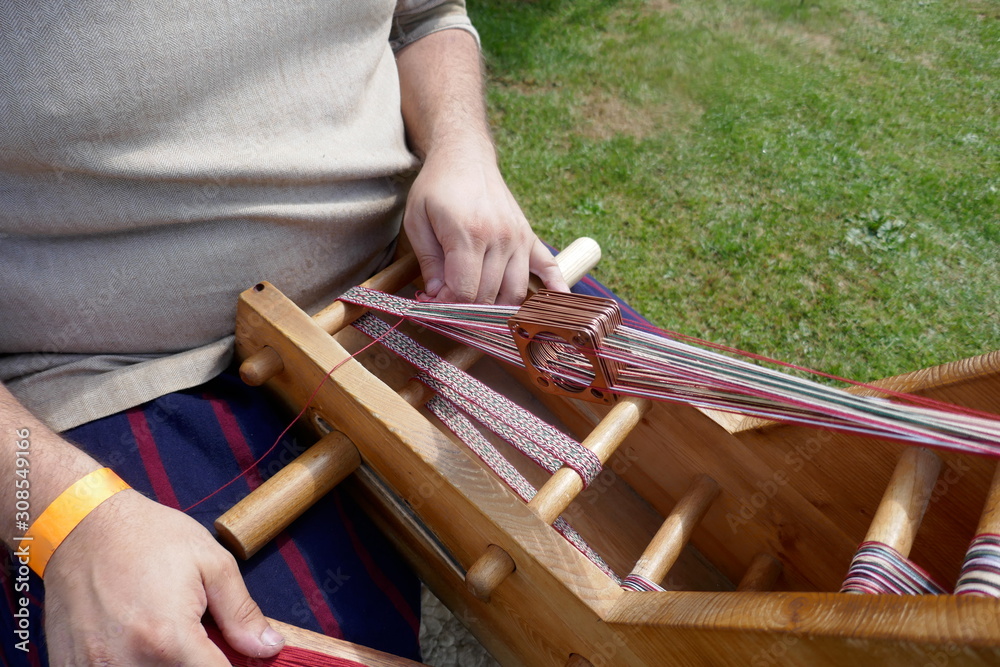 Loom with weaving shuttle for making borders and edgings. Old craft ...