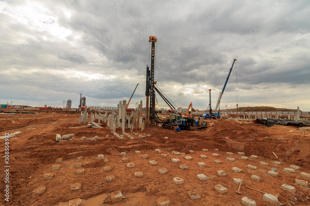 Pile driving in foundation pit construction apartment building. Piling ...