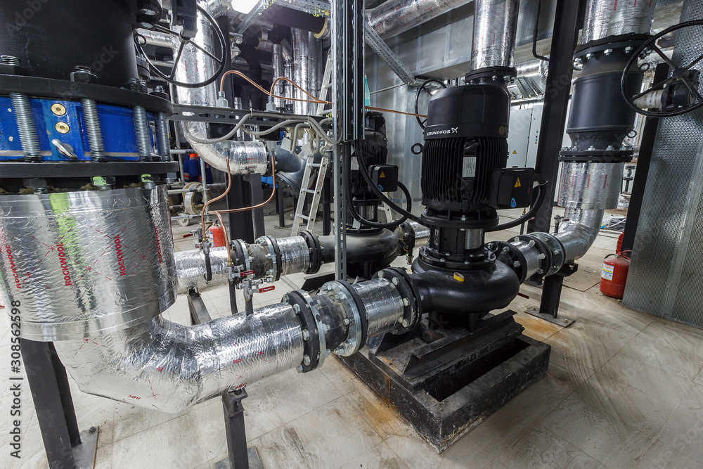 pumping station under construction. pipes of central heating system and ...