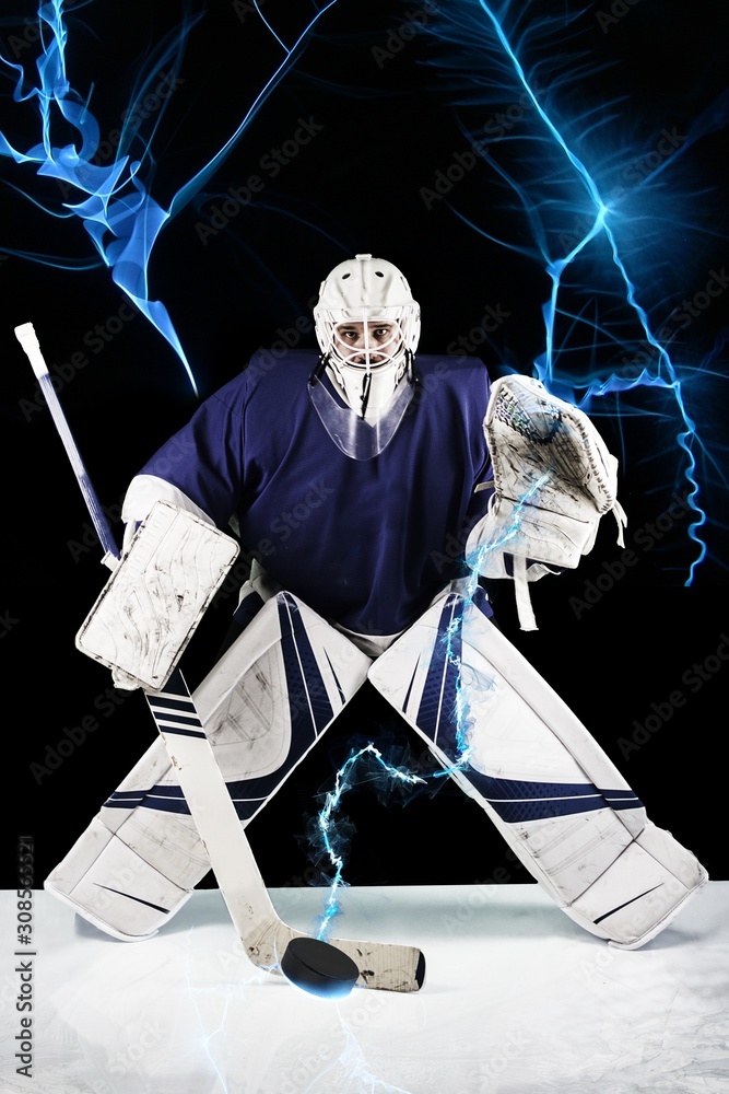 Hockey goalie stands UNDER BLUE FLASHES LIGHTNING ready to catch the ...