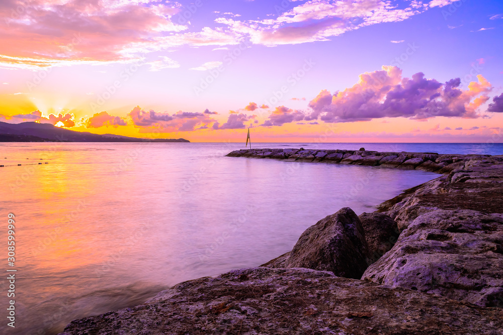 Magnificent sunset with colorful sky colors as sun sets behind ...