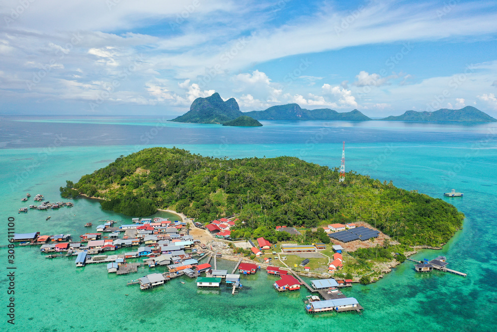 Aerial view of the Selakan island with crystal clear water, blue sky ...