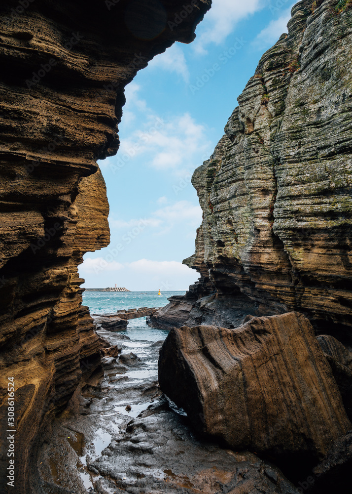 Yongmeori Beach sandstone cliff rock formation in Jeju Island, Korea ...
