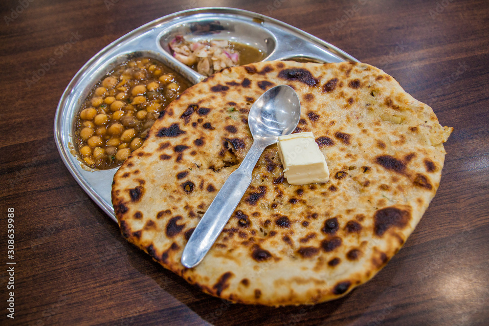 Amritsari Kulcha (Clay-baked stuffed Naan), typical meal of Amritsar ...