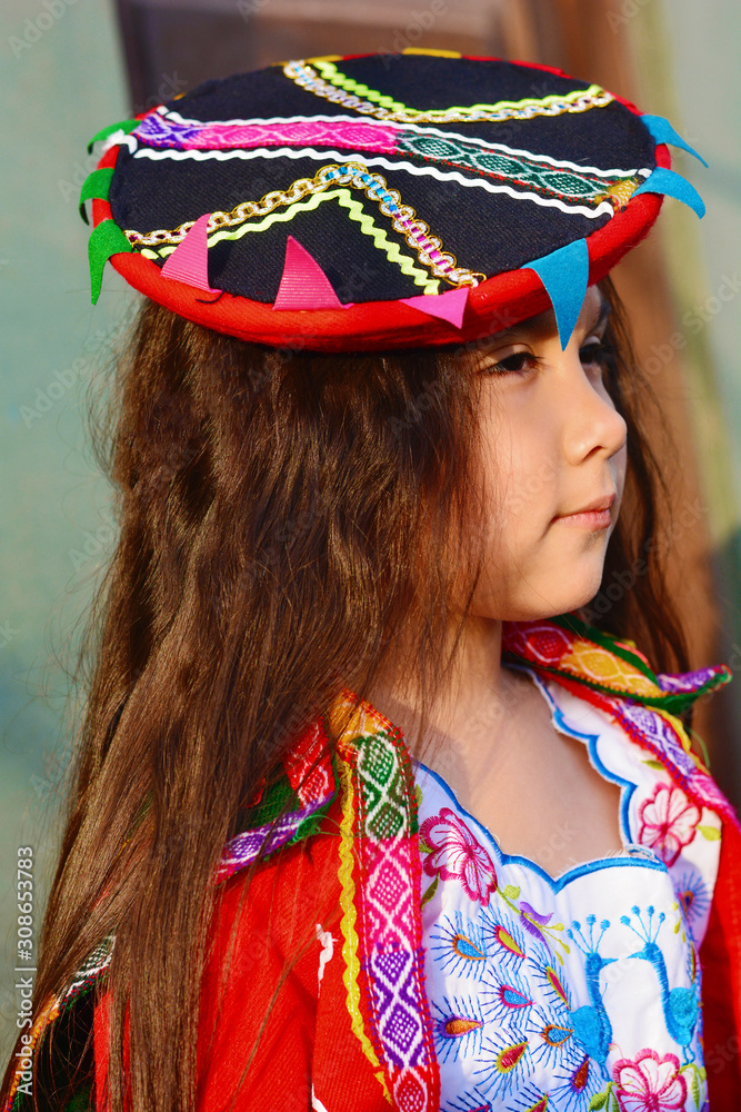 Little peruvian girl wearing typical clothes from Cusco. Stock Photo ...