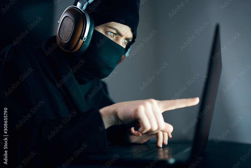 thief stealing data from laptop Stock Photo | Adobe Stock