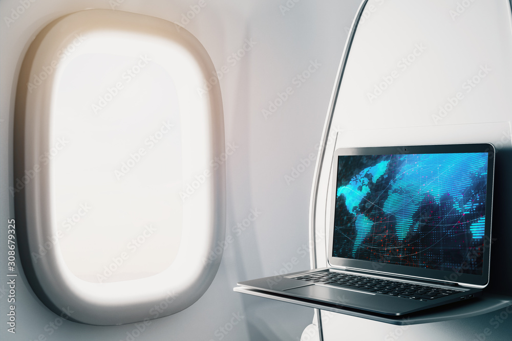 Laptop closeup inside airplane with world map on screen. International ...