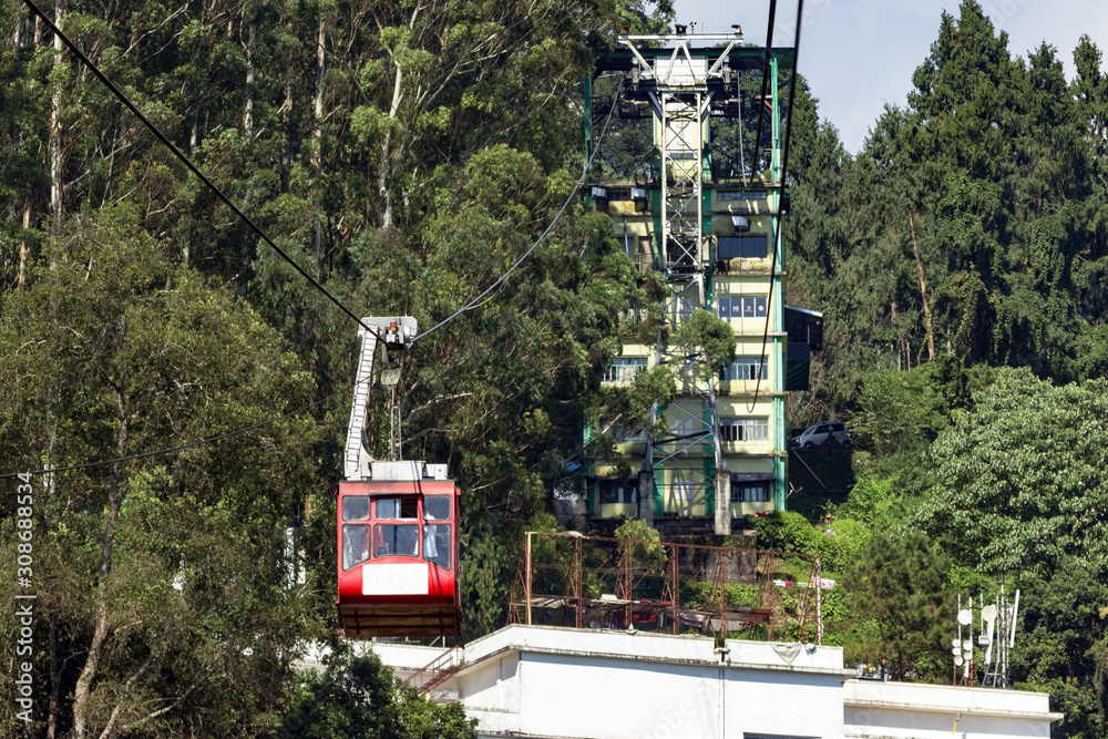 Big cabin of the cable car .The red cabin of the ropeway with tourists ...
