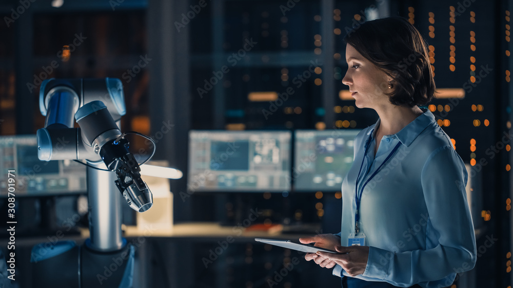 Female Engineer with Tablet Computer Analyse How a Futuristic Robotic ...