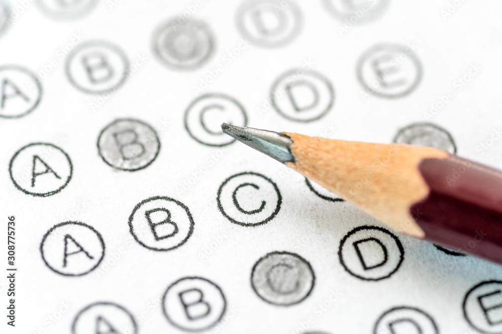 pencil and paper sheet with answers to test. students testing, school ...