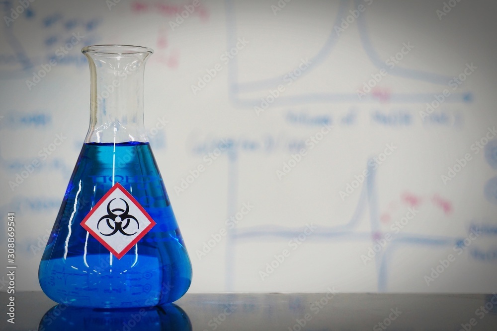 Erlenmeyer flask with Deep Blue liquid and chemical hazard warning ...