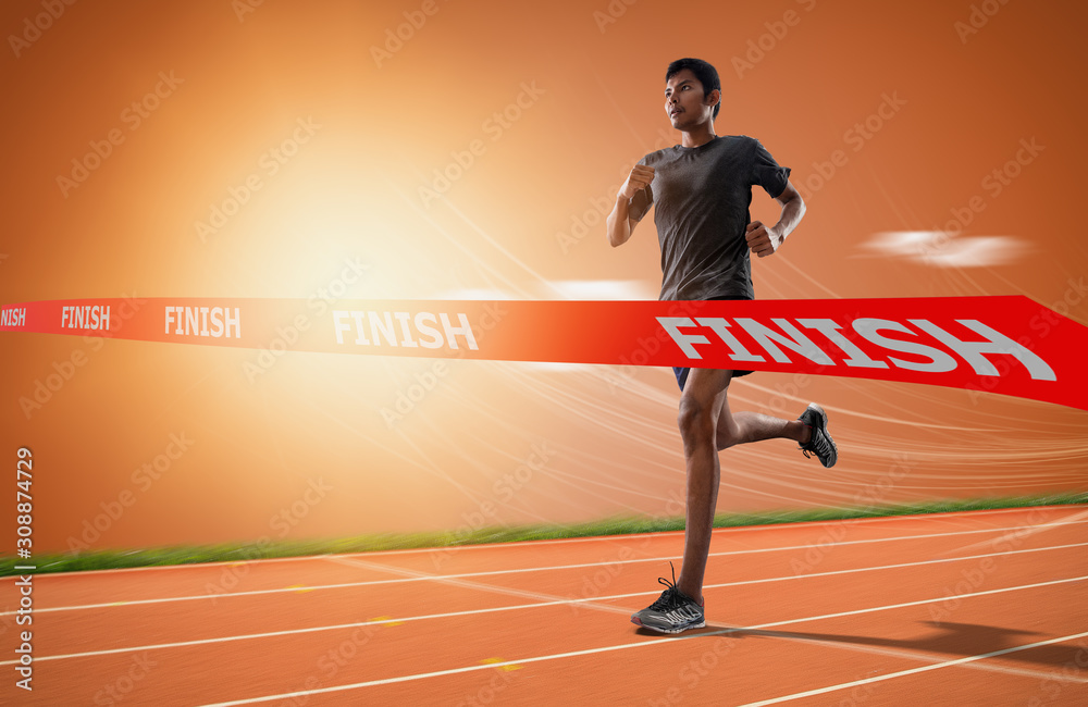 Winning young male Athlete crosses the finish line. Stock Photo | Adobe ...