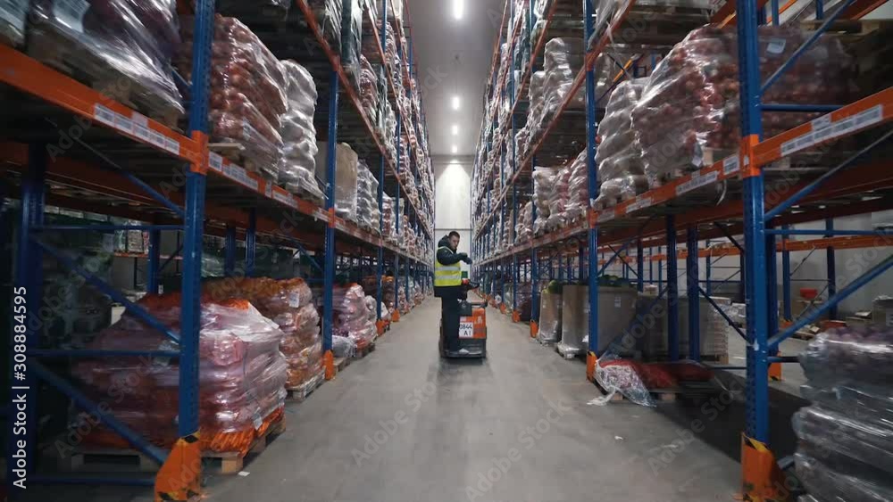 loader moves on a forklift in a warehouse Stock Video | Adobe Stock