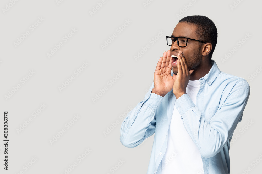 Emotional african american millennial guy shouting at copyspace. Stock ...