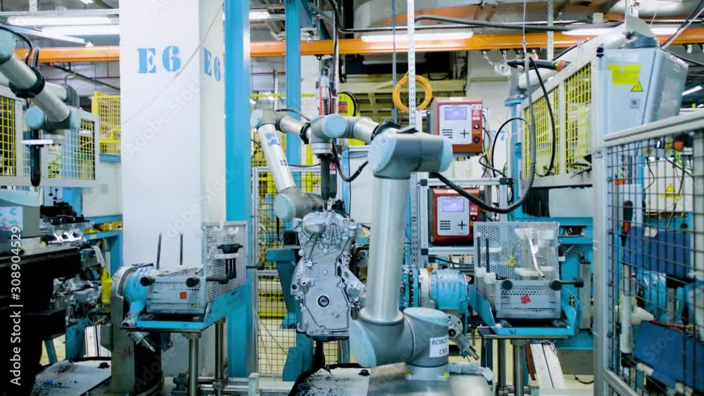 Automated robots at work inside an automobile manufacturing plant Stock ...