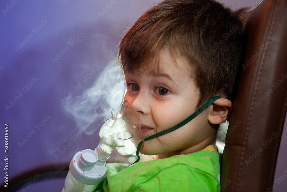 Little boy in a mask, treatments respiratory tract with a nebulizer at ...