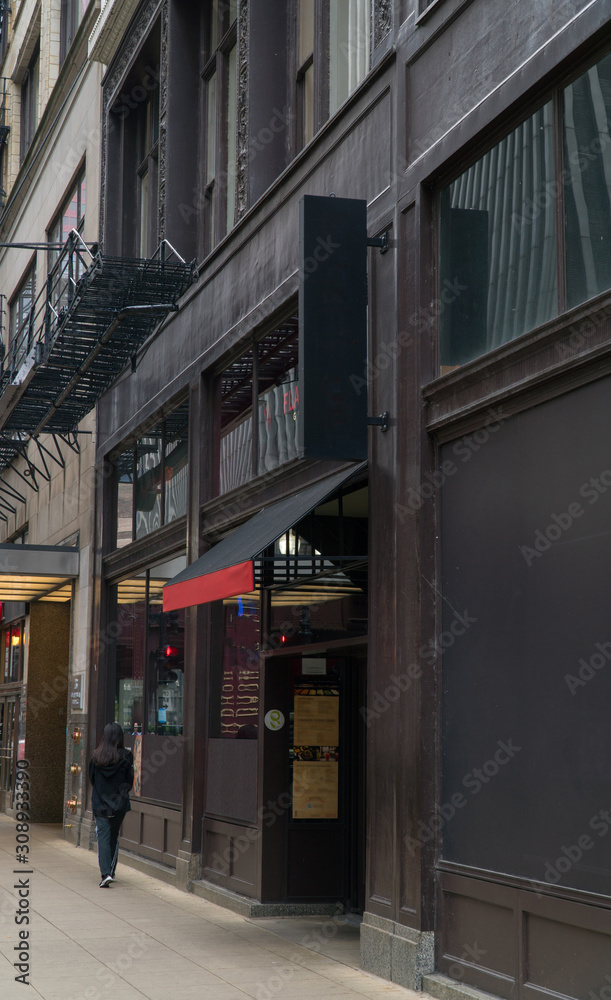 Generic restaurant bar exterior establishing shot facade on city street ...