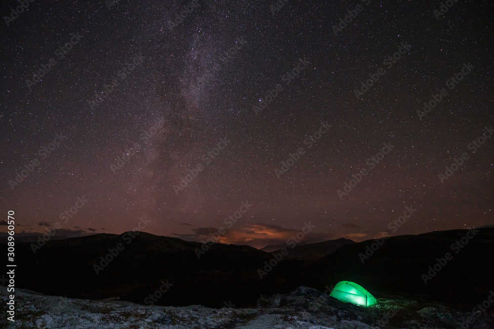 Milky way and starry sky over night scene outdoors in the forest and ...