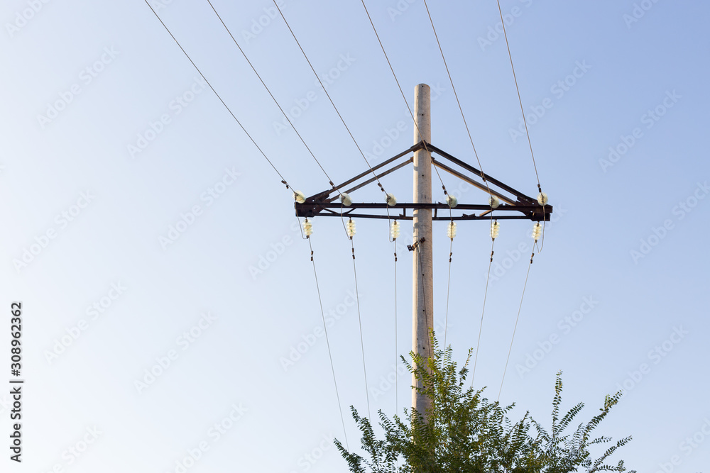 Concrete pillar power lines with steel traverses, porcelain insulators ...
