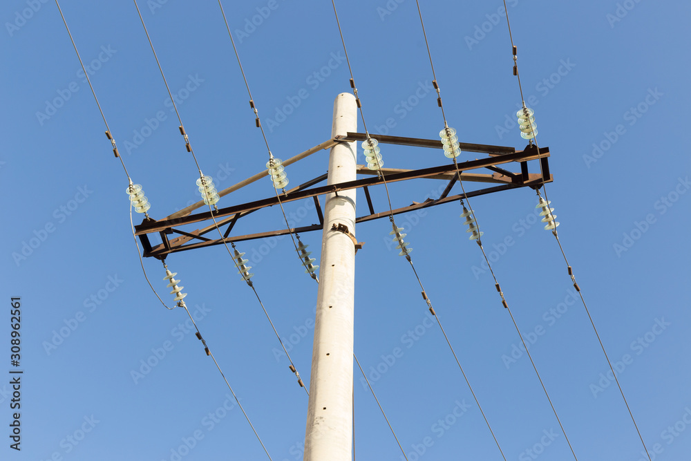 Concrete pillar power lines with steel traverses, porcelain insulators ...